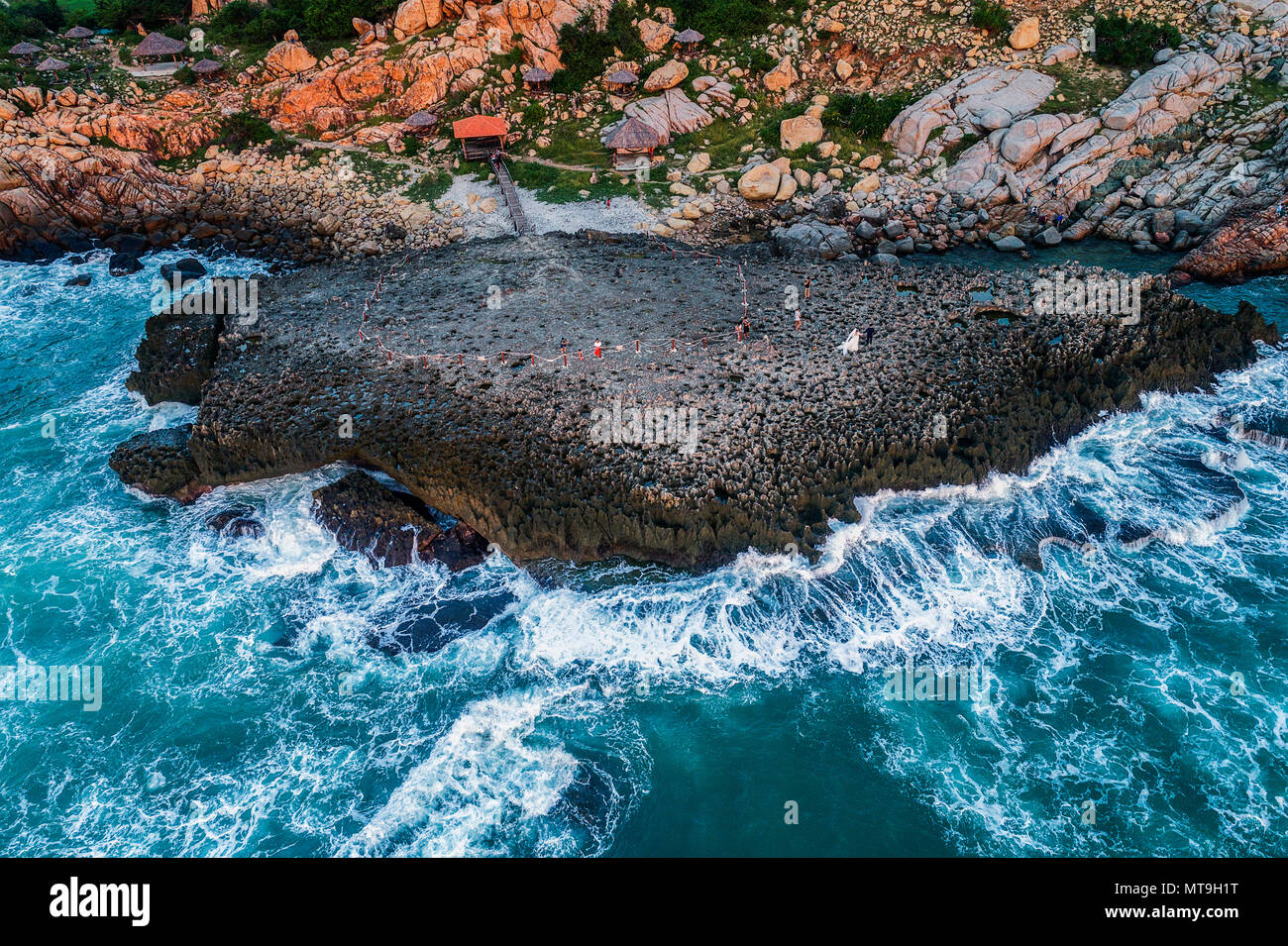 Aerial sunrise view of Rocky Hang Rai beach, Vietnam Stock Photo - Alamy