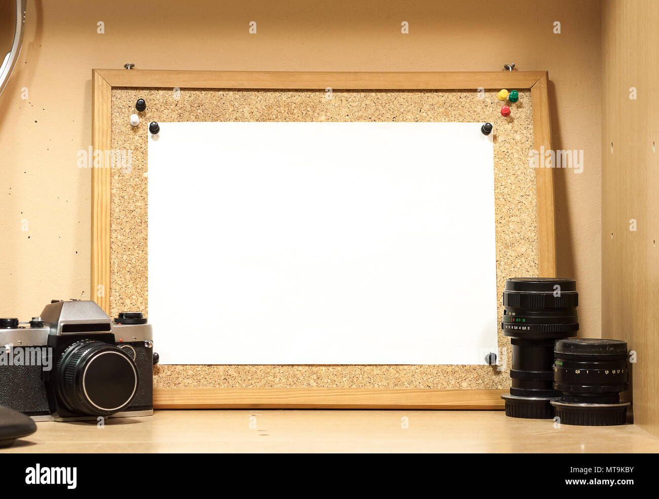 A cork board with a white sheet of paper. Background for mockup. Place ...