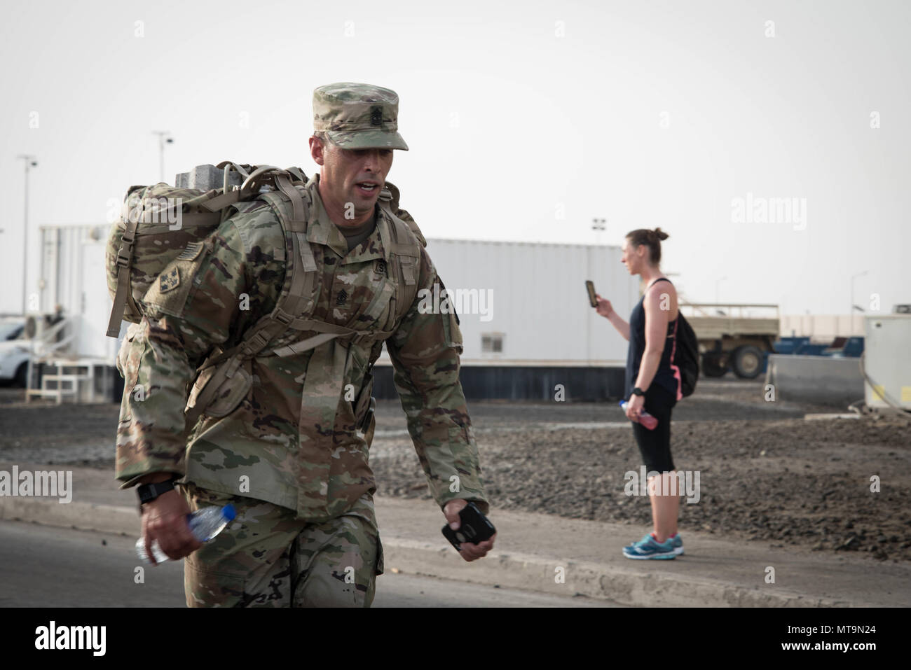 Members from Al Dhafra Air Base participate in a 5k run and ruck march ...