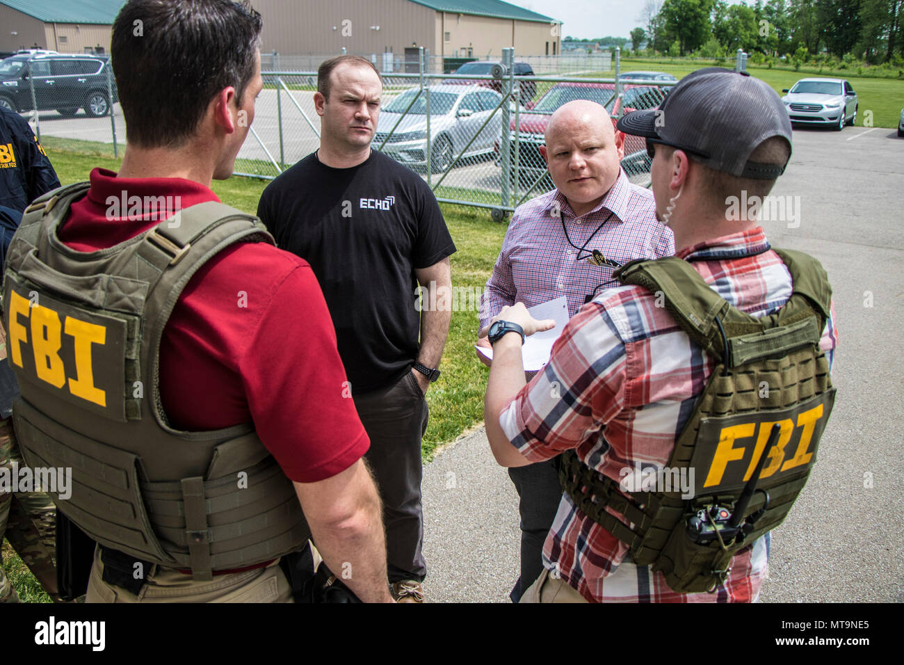 FBI agents discuss a simulated search warrant with network owners ...