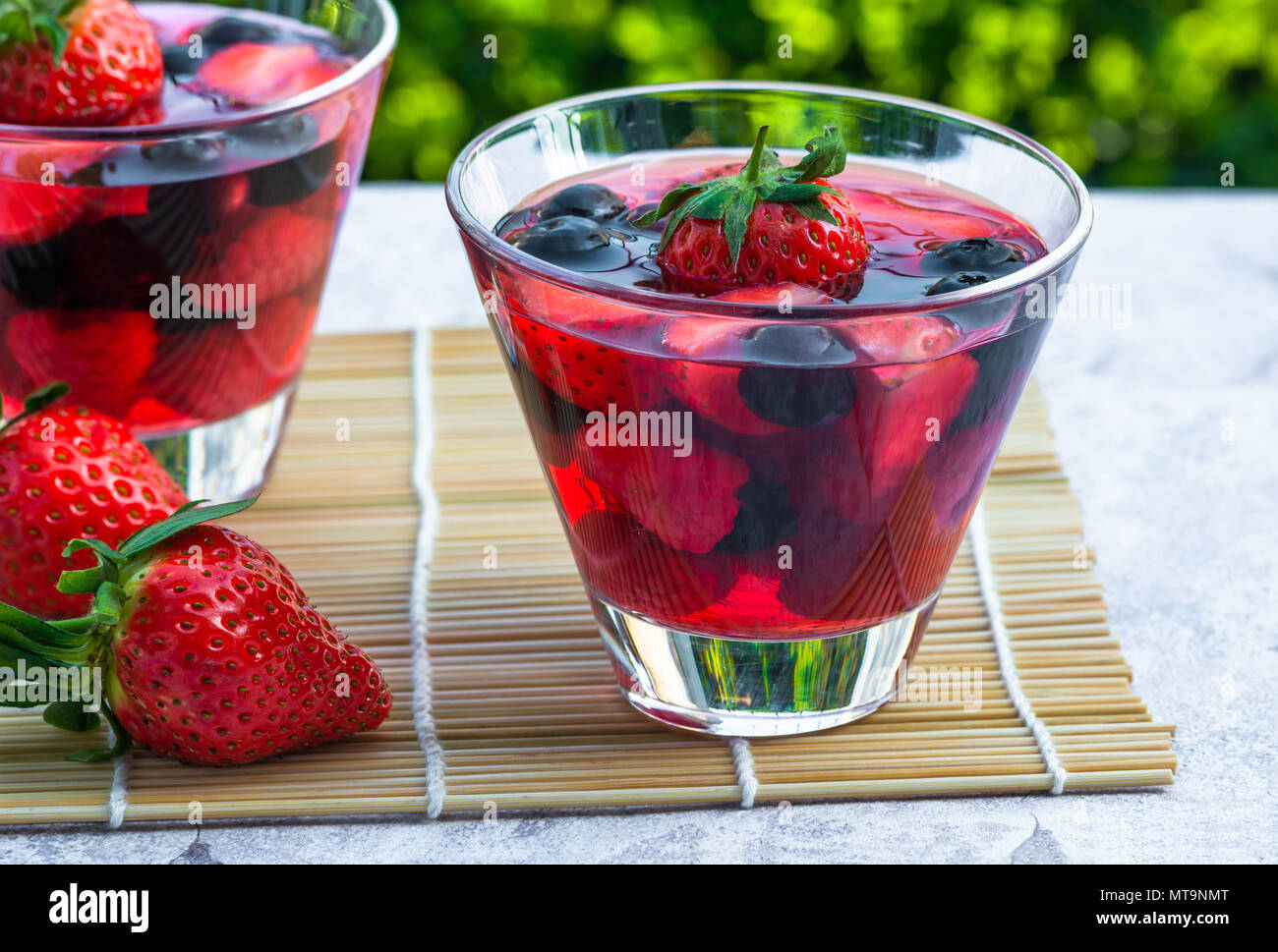 Fruit jelly with summer berries garnished with fresh mint Stock Photo ...