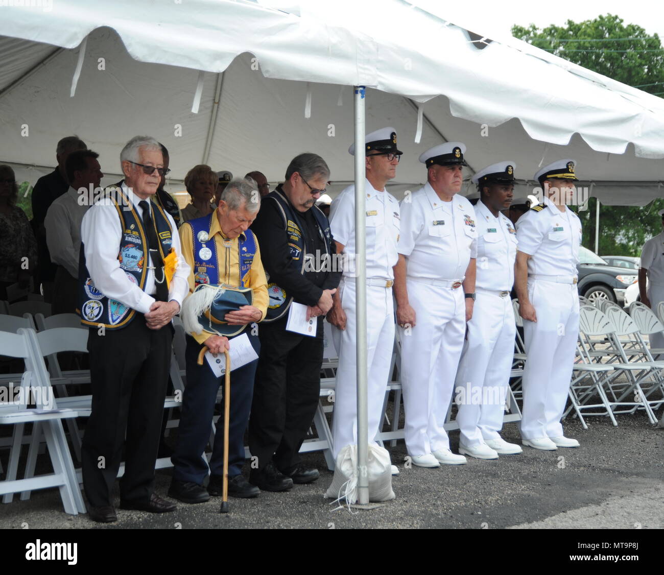 Submarine veterans, active duty submariners, family and friends stand ...