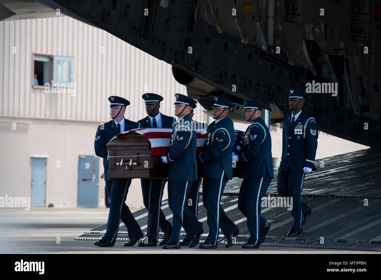 Airmen from the U.S. Air Force Honor Guard perform a dignified arrival ...
