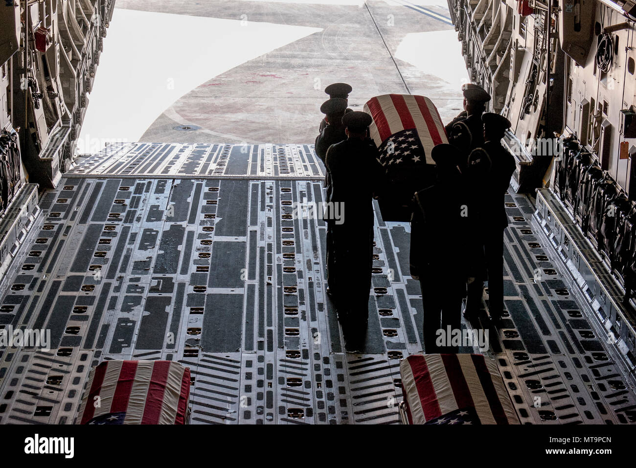 Airmen from the U.S. Air Force Honor Guard perform a dignified arrival ...
