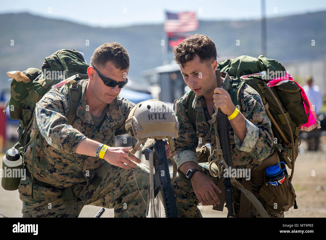 Staff Sgt. Curtis Garrison, left, range scheduler, Headquarters and ...