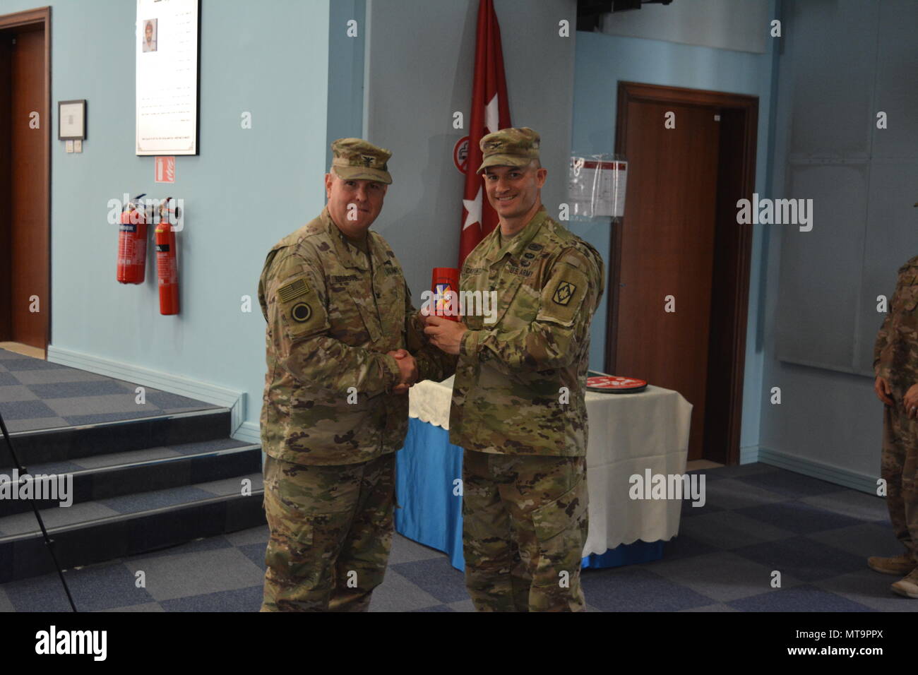 Col. Adam Robinson (left), commander of the 65th Field Artillery ...