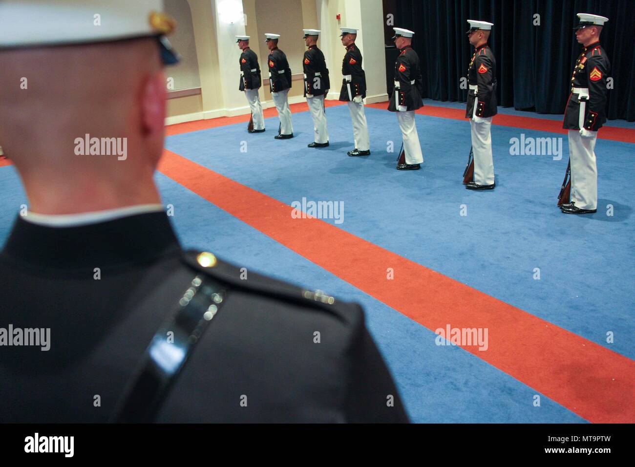 U.S. Marines with the Silent Drill Platoon perform during an evening ...