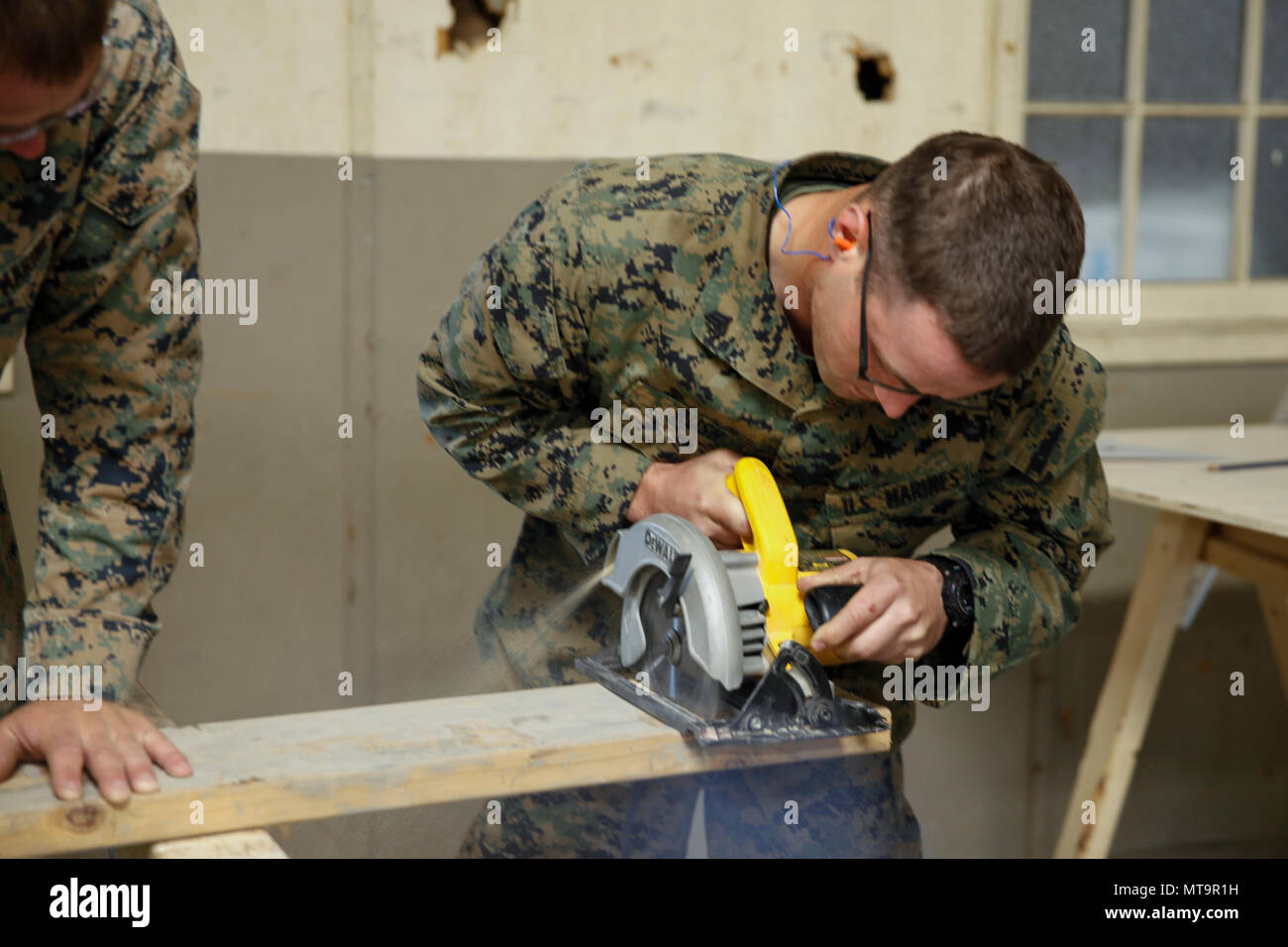 U.S. Marine Sgt. Derek R. Rush (right), squad leader with Headquarters ...