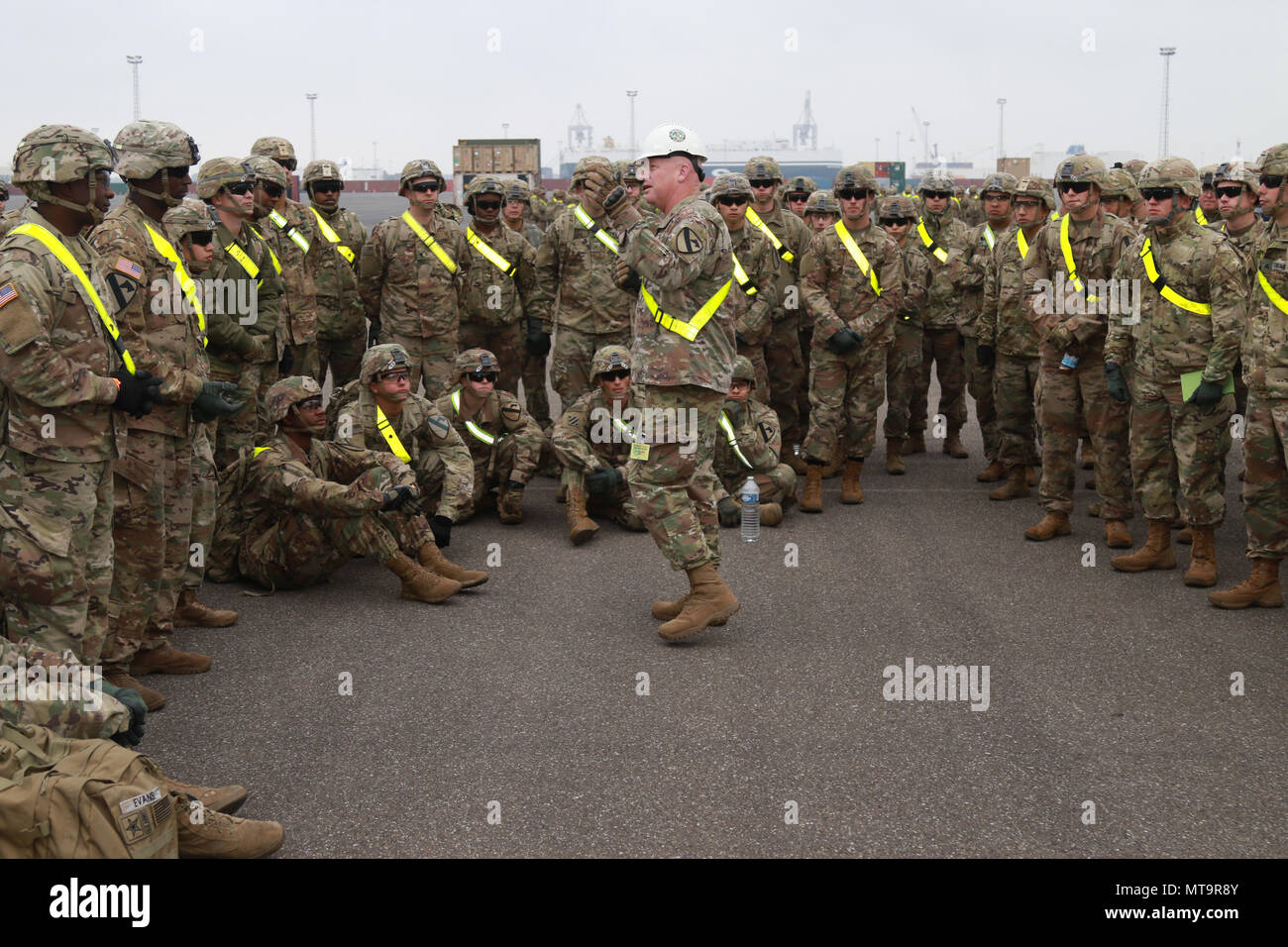Port operations are underway unloading combat vehicles of the !st ...