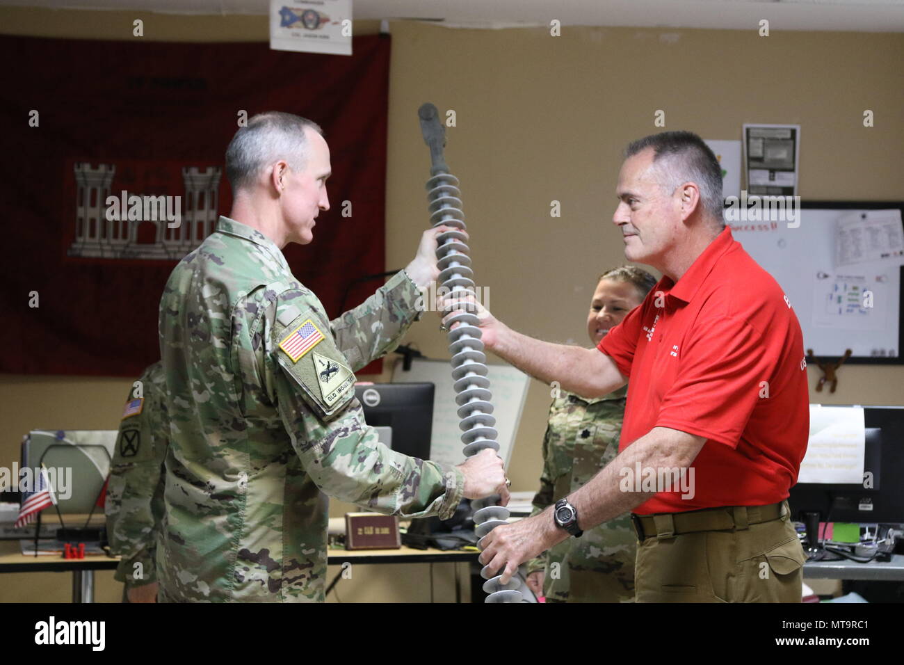 U.S. Army Colonel Jason Kirk conducts a battle rhythm handover to LTC ...