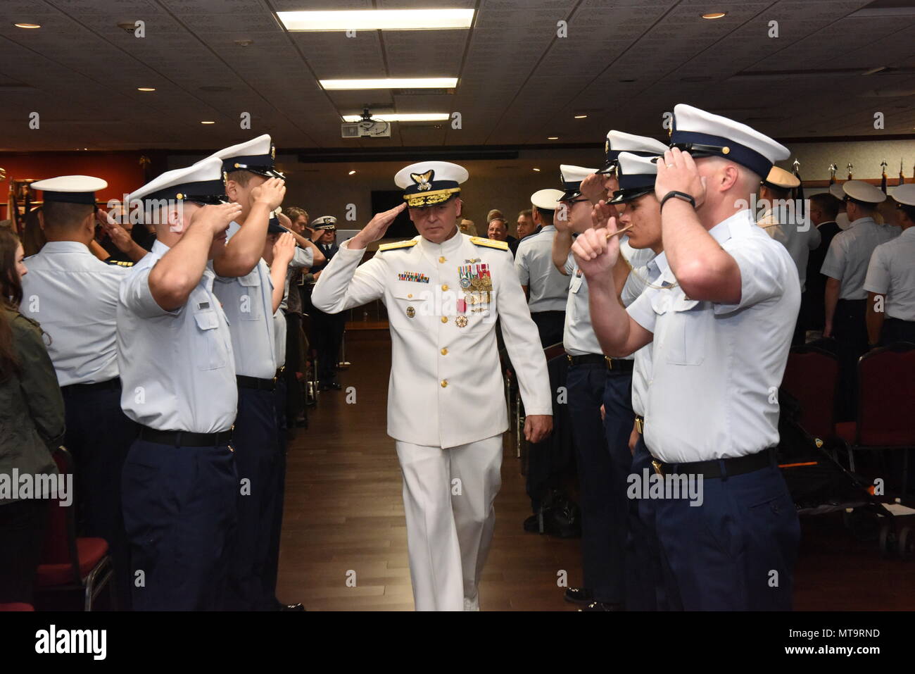U.S. Coast Guard Reserve Rear Adm. Francis “Stash” Pelkowski, salutes ...