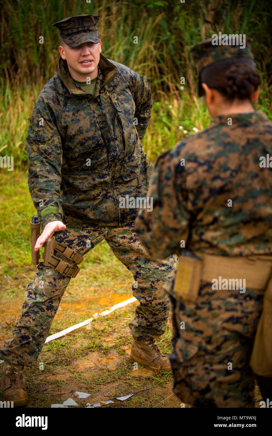 Capt. Troy D. Goss provides feedback to 2nd Lt. Jennifer N. Galvan ...