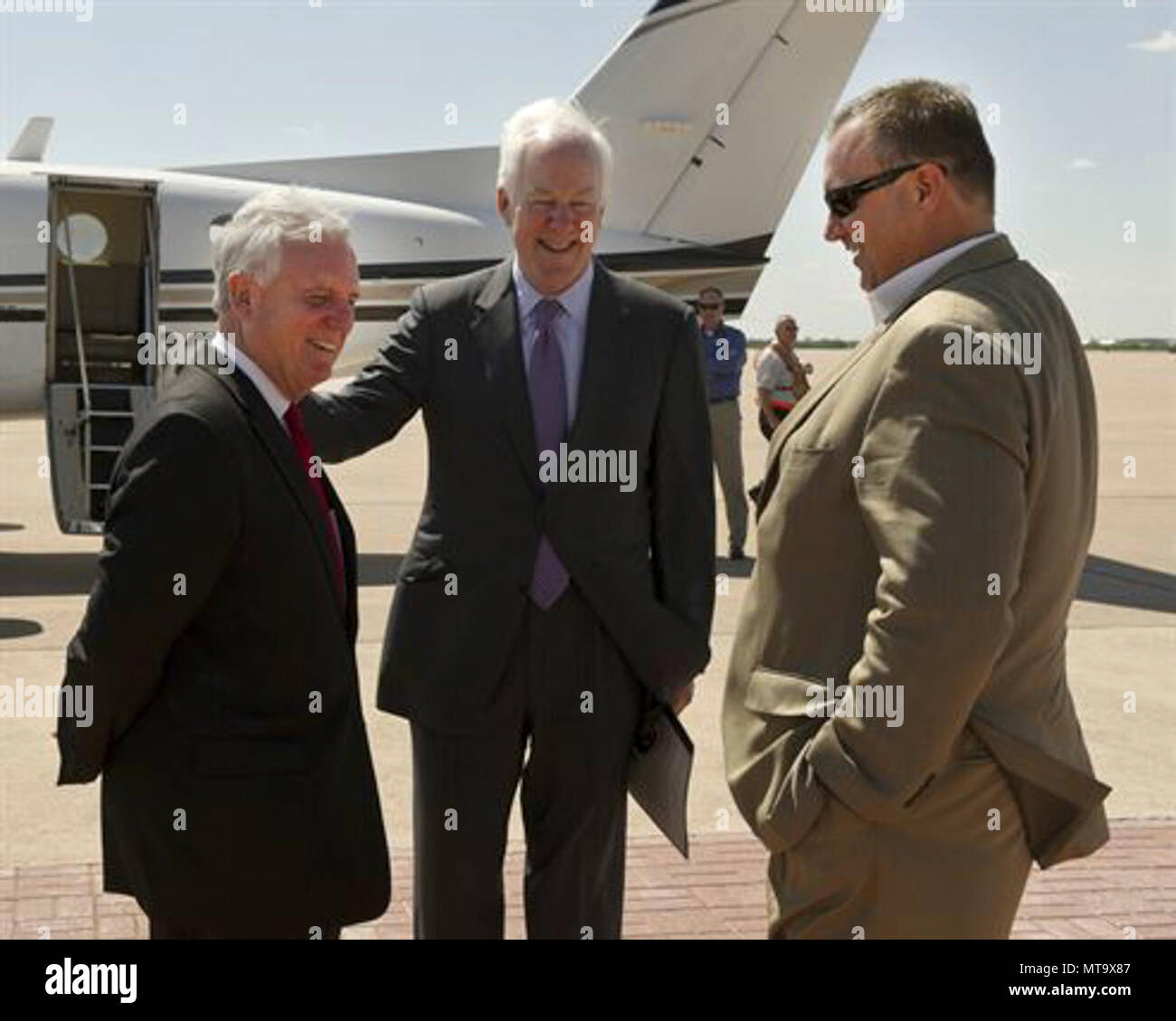 U.S. Sen. John Cornyn, R-TX, center, shares a laugh with Abilene Mayor ...