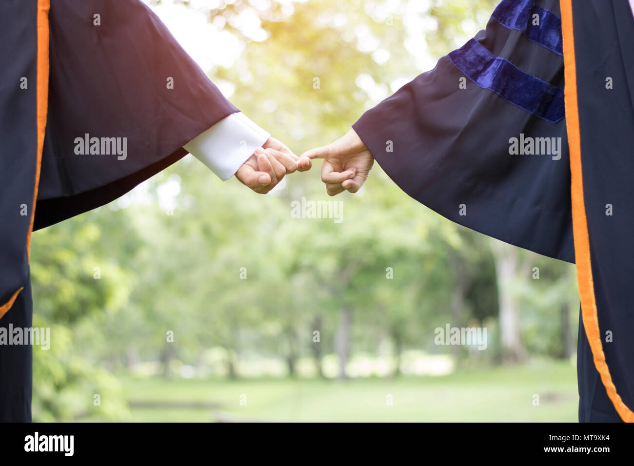 Student hand in hand and walk together, concept in teamwork ...