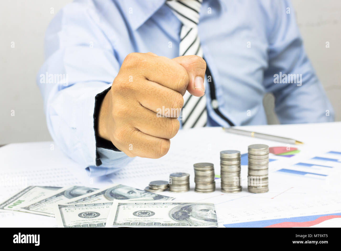 Money in fist winner hi-res stock photography and images - Alamy