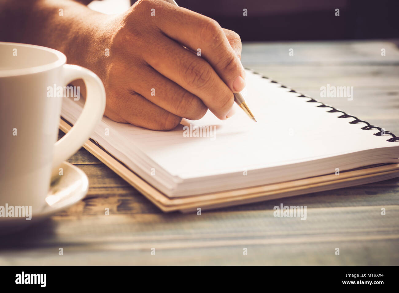 Writing dairy on notebook in coffee shop, concept as memory of life and ...