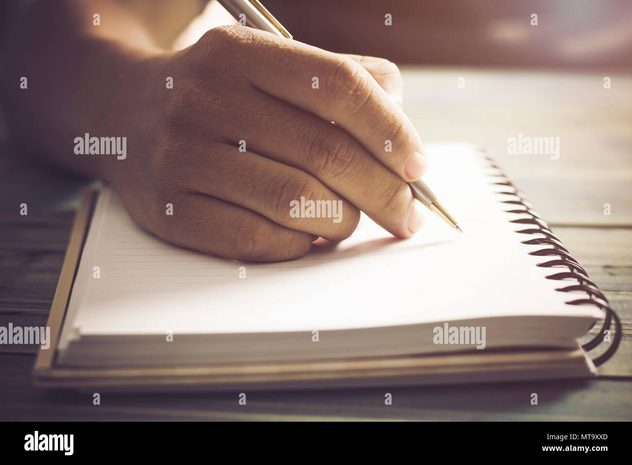 Writing dairy on notebook in coffee shop, concept as memory of life and ...