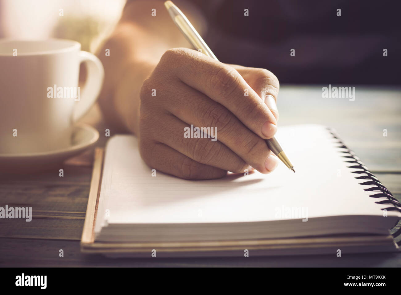 Writing dairy on notebook in coffee shop, concept as memory of life and ...