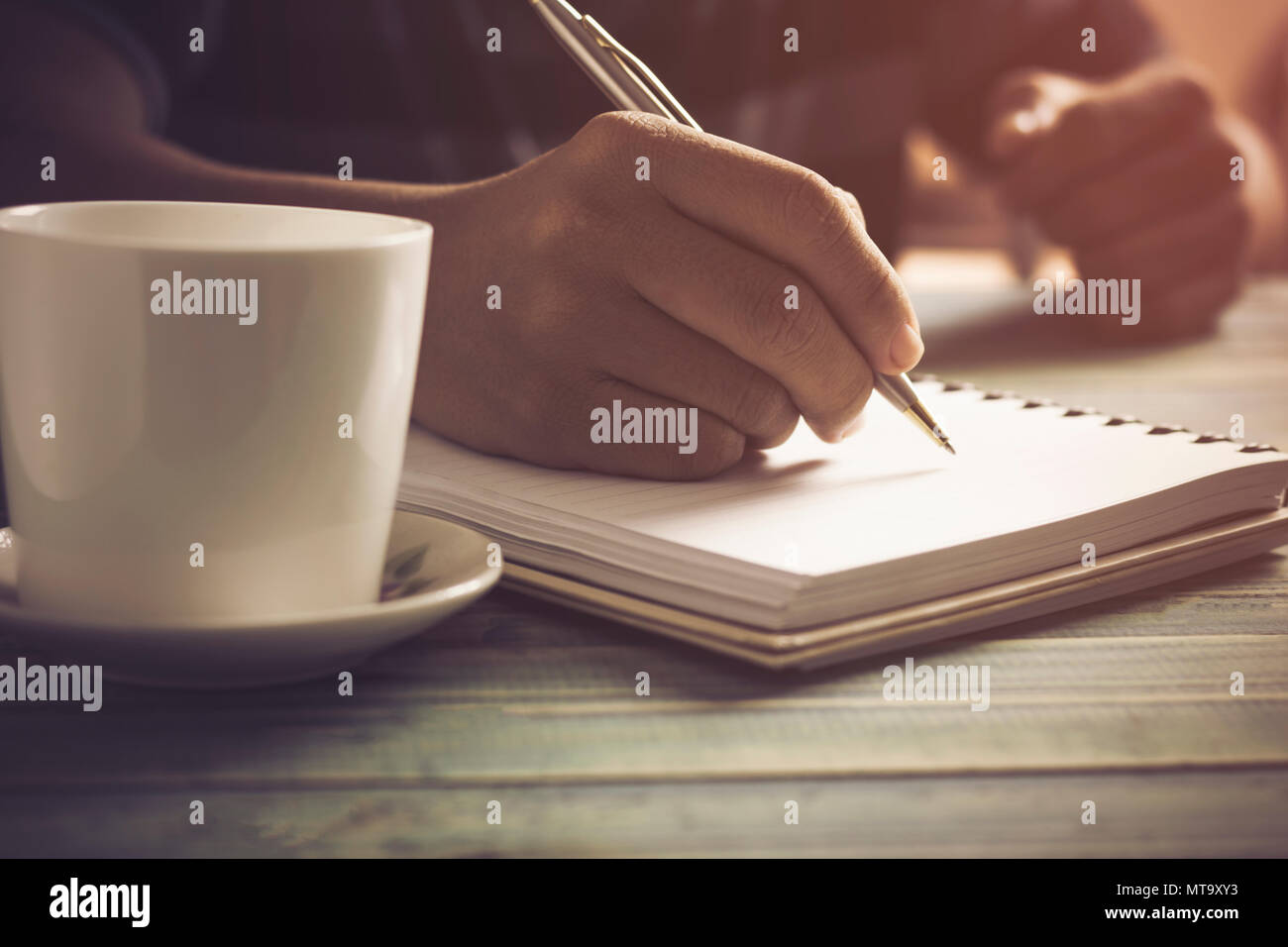 Writing dairy on notebook in coffee shop, concept as memory of life and ...