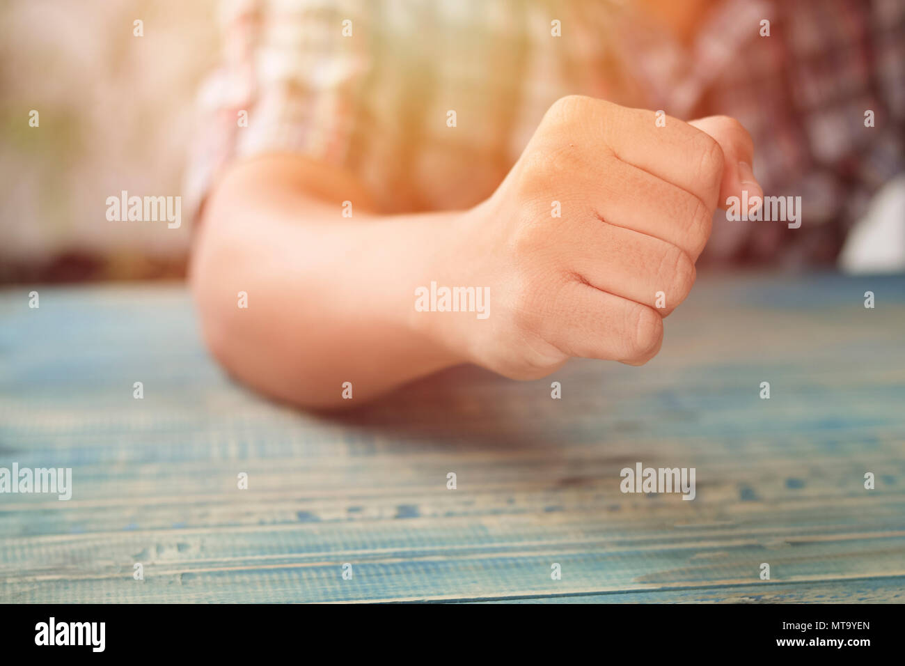 Male fist on table hi-res stock photography and images - Alamy