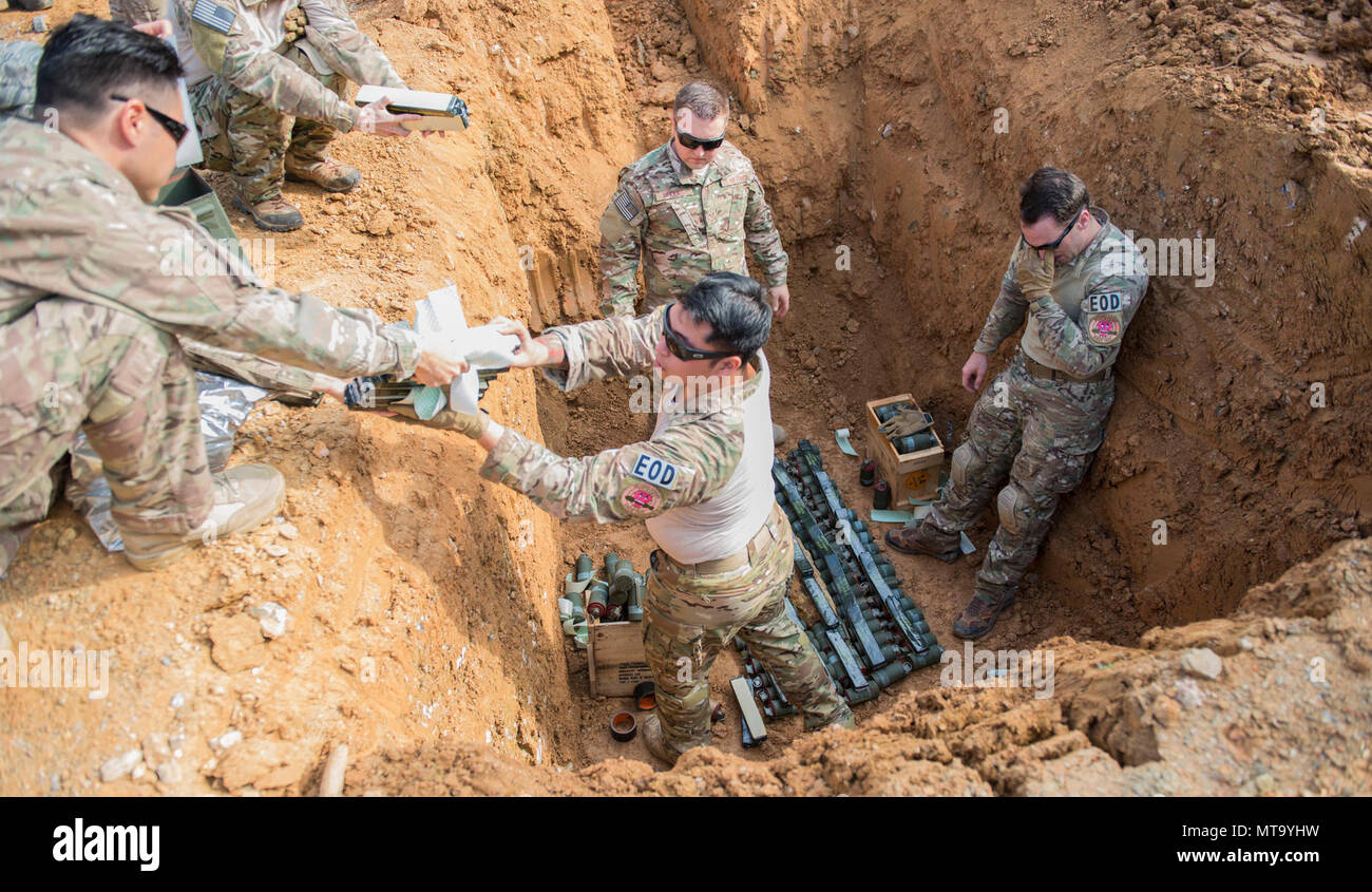 Explosive ordnance disposal team members from the 18th Civil Engineer ...