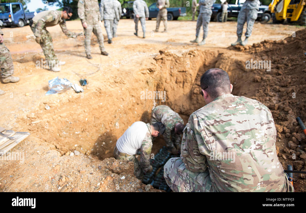 Explosive ordnance disposal team members from the 18th Civil Engineer ...