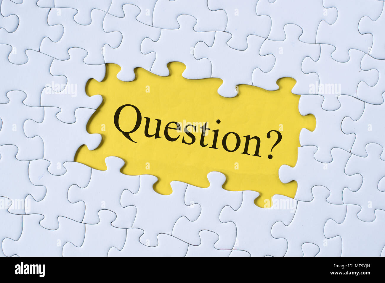 question word on jigsaw puzzle with yellow background. questions, faq ...