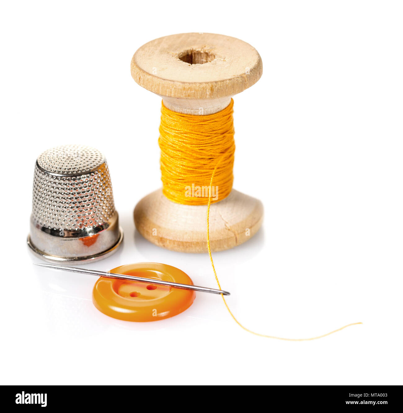 spool of thread and buttons on white isolated background Stock Photo ...
