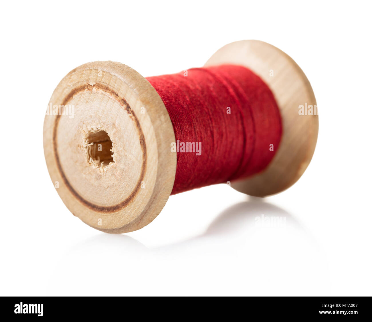 spool of red thread on white isolated background Stock Photo - Alamy
