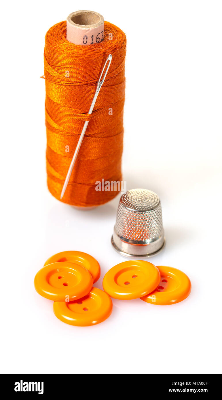 spool of thread and buttons on white isolated background Stock Photo ...