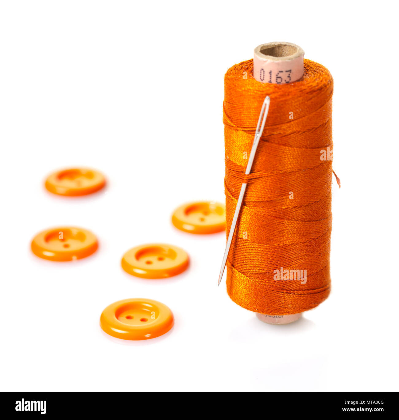 spool of thread and buttons on white isolated background Stock Photo ...