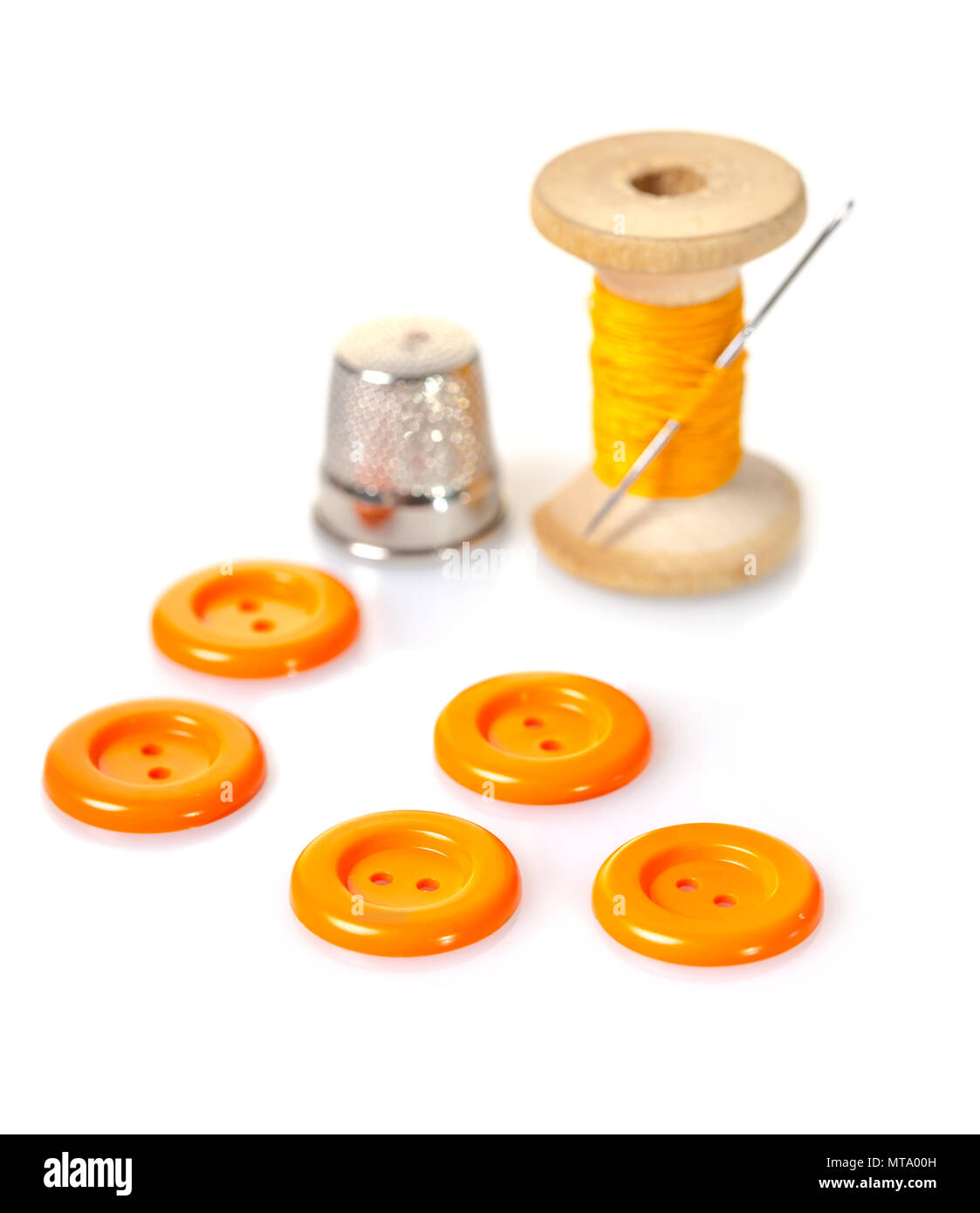 spool of thread and buttons on white isolated background Stock Photo ...