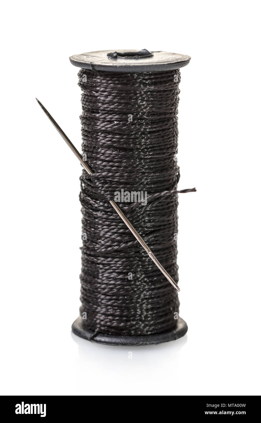 spool of black thread on white isolated background Stock Photo - Alamy
