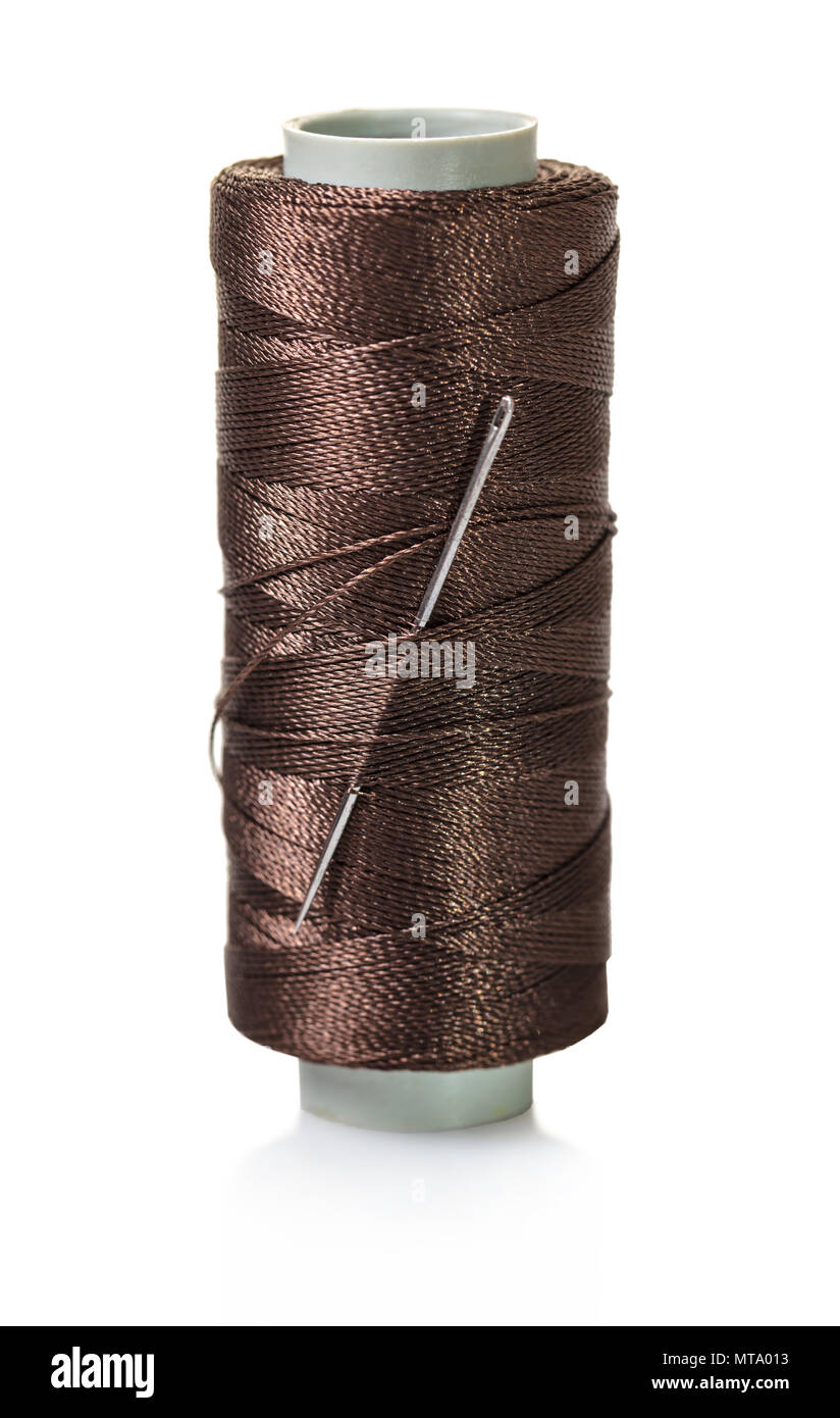 spool of brown threads on a white isolated background Stock Photo - Alamy