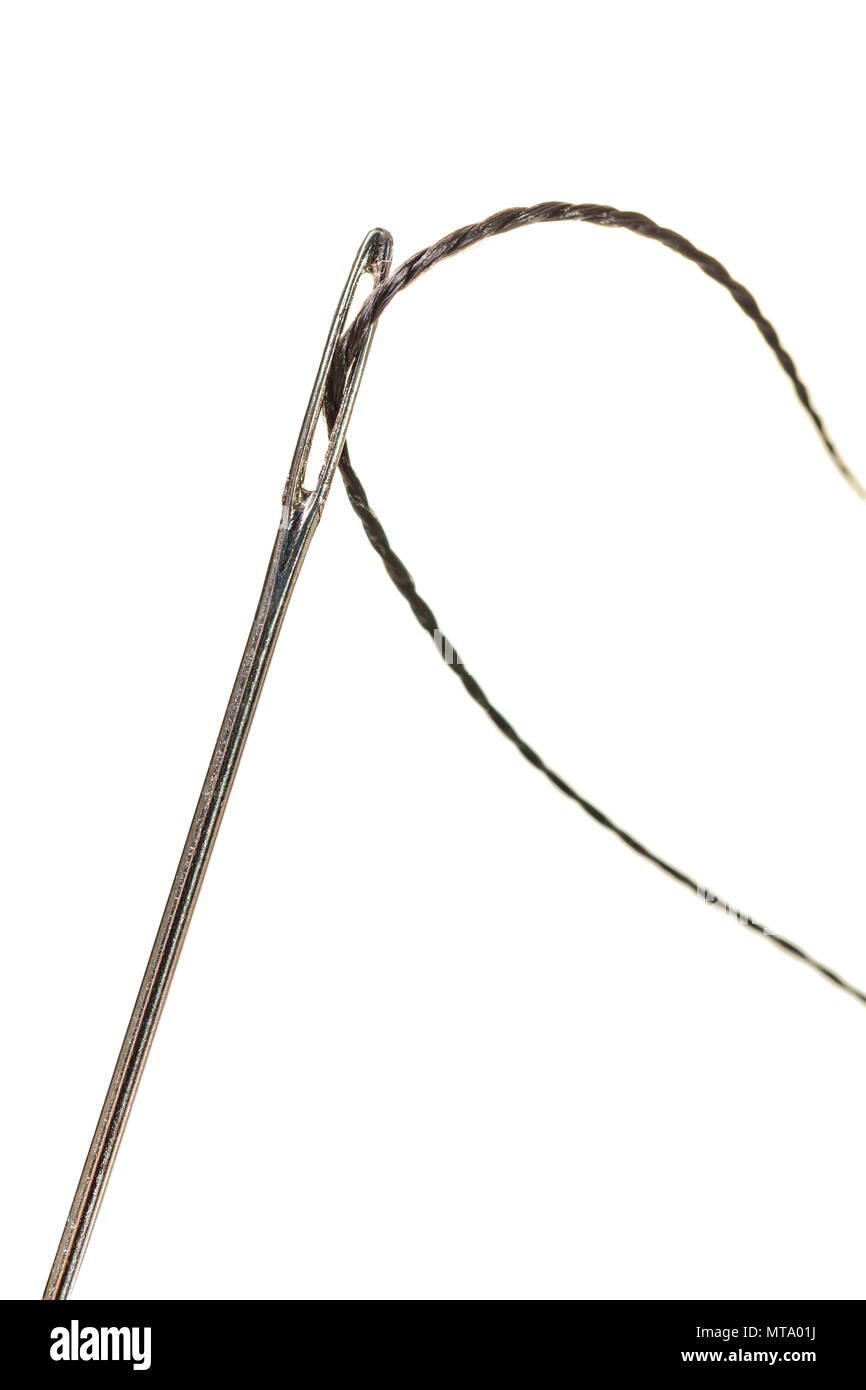 black thread in a needle on a white isolated background Stock Photo - Alamy