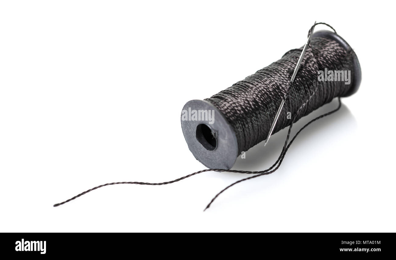 spool of black thread on white isolated background Stock Photo - Alamy