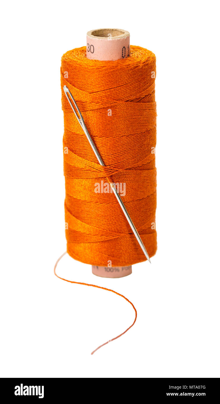 spool of thread with a needle on white isolated background Stock Photo ...
