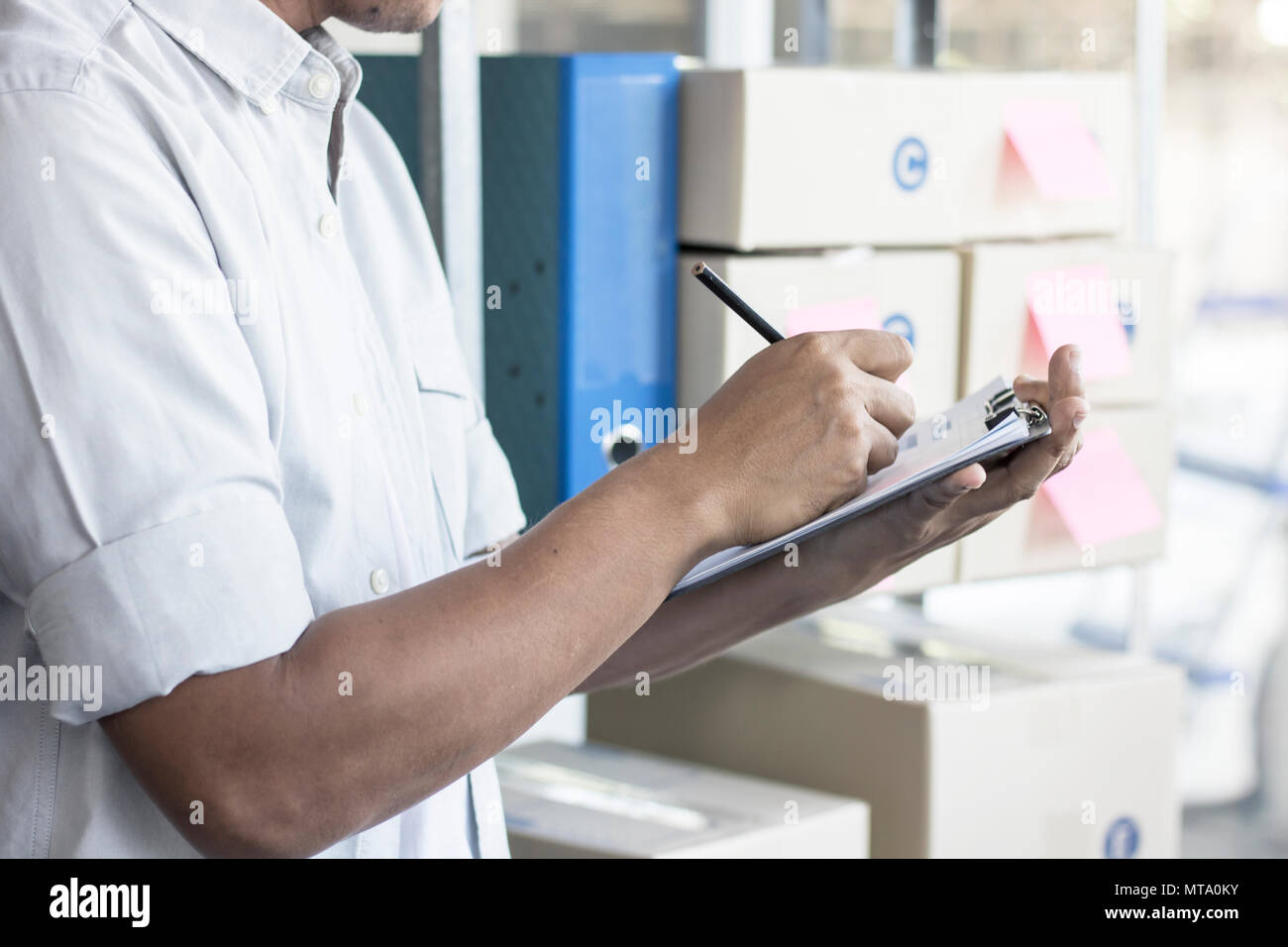 businessman checking list of goods Stock Photo - Alamy