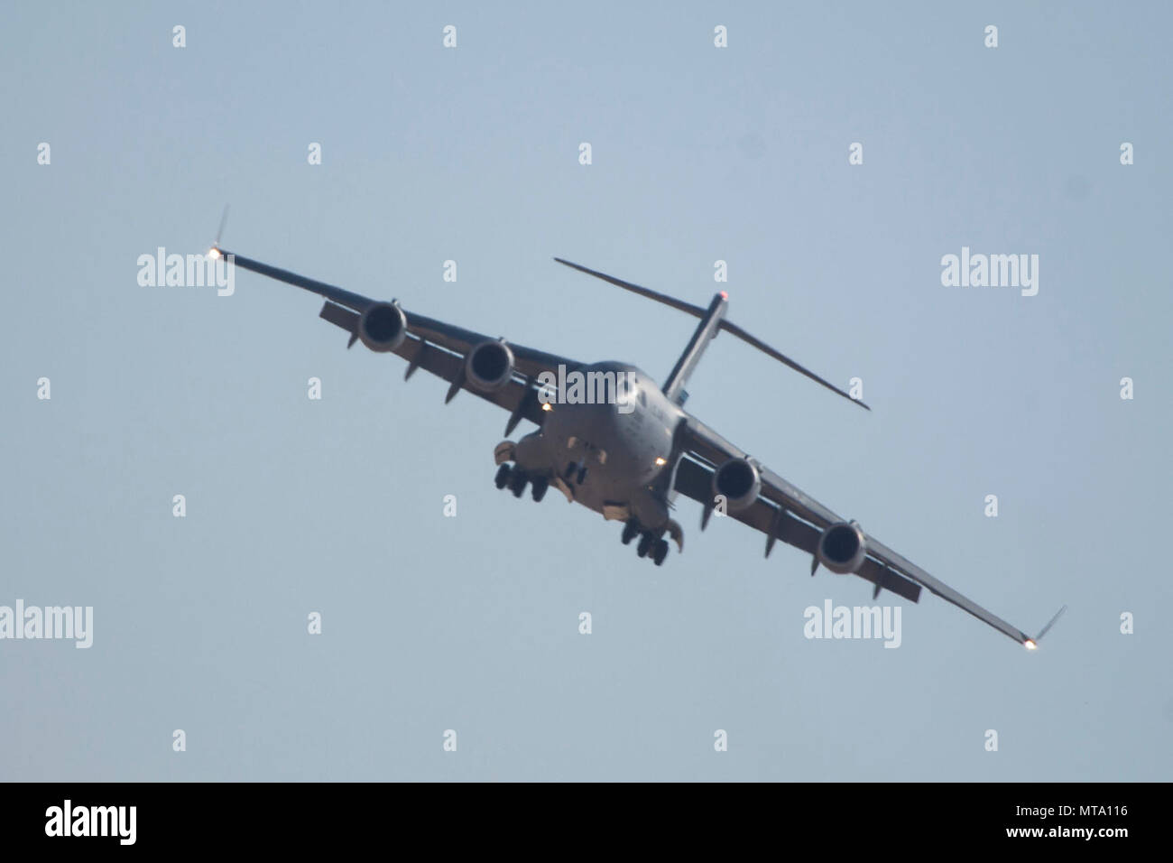 A U.S. Air Force C17 Globemaster III conducts low approaches with a ...