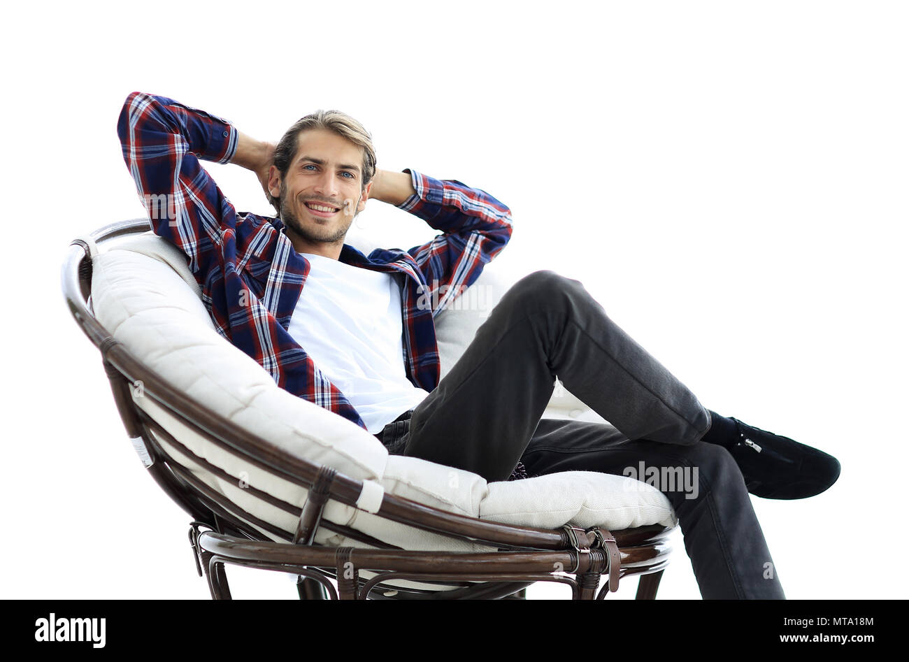 close-up. a successful guy sitting in a large round comfortable chair ...