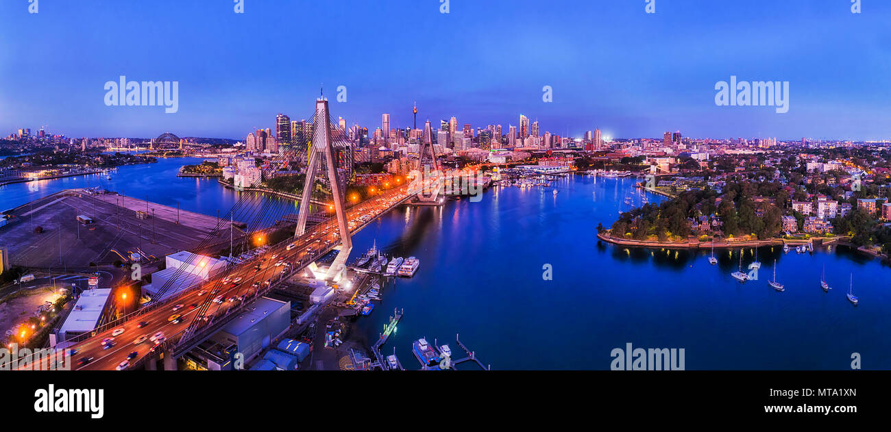 Dark blue time after sunset over Sydney city CBD along ANZAC bridge ...
