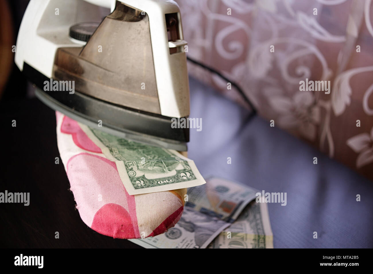 Money ironing hi-res stock photography and images - Alamy