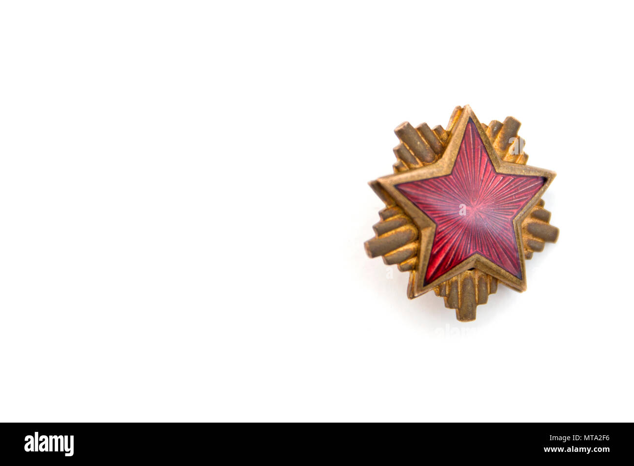 Old red star from communist military cap isolated on the white ...