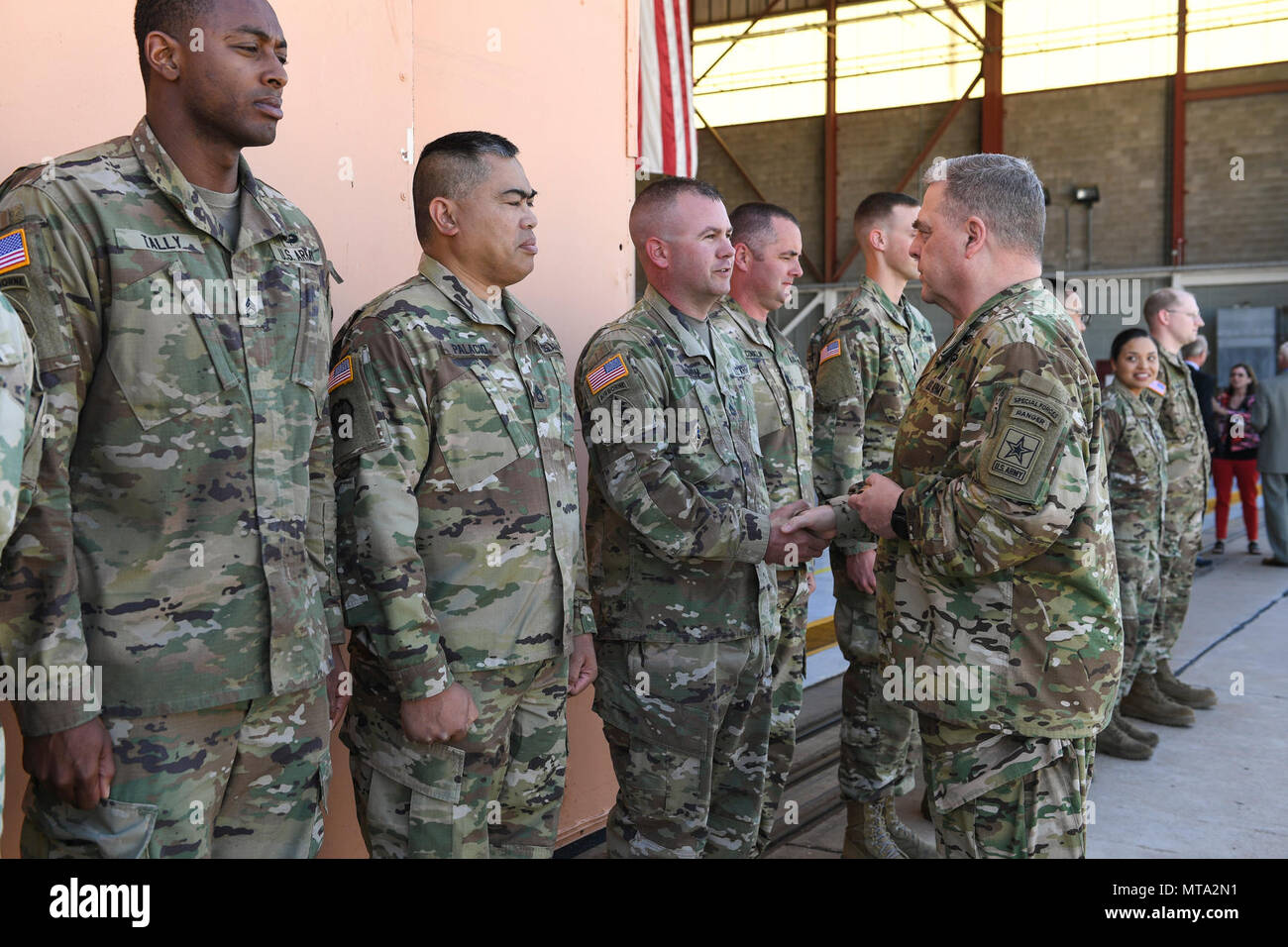 U.S. Army Chief of Staff Gen. Mark A. Milley coins Soldiers during a ...