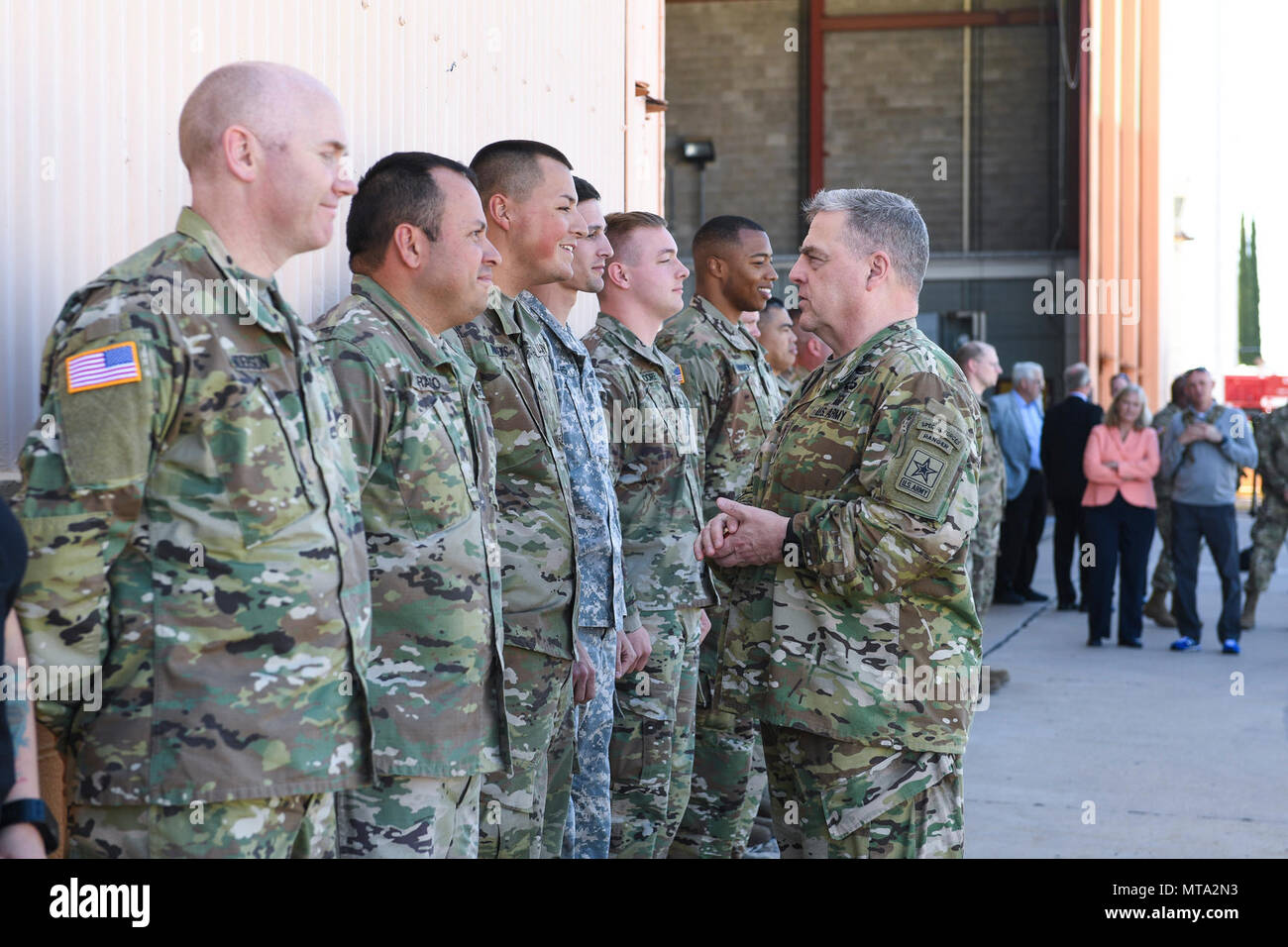 U.S. Army Chief of Staff Gen. Mark A. Milley coins Soldiers during a ...