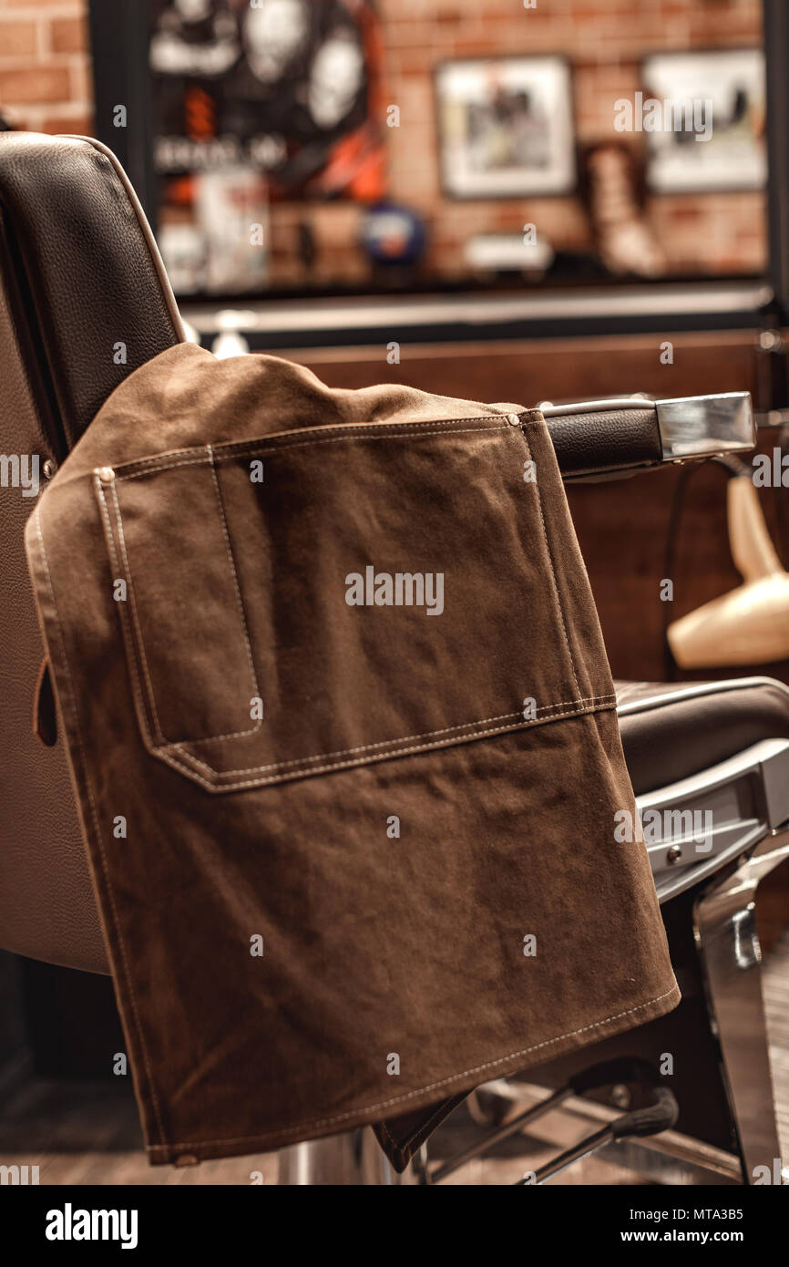 apron on chair in barber shop Stock Photo - Alamy