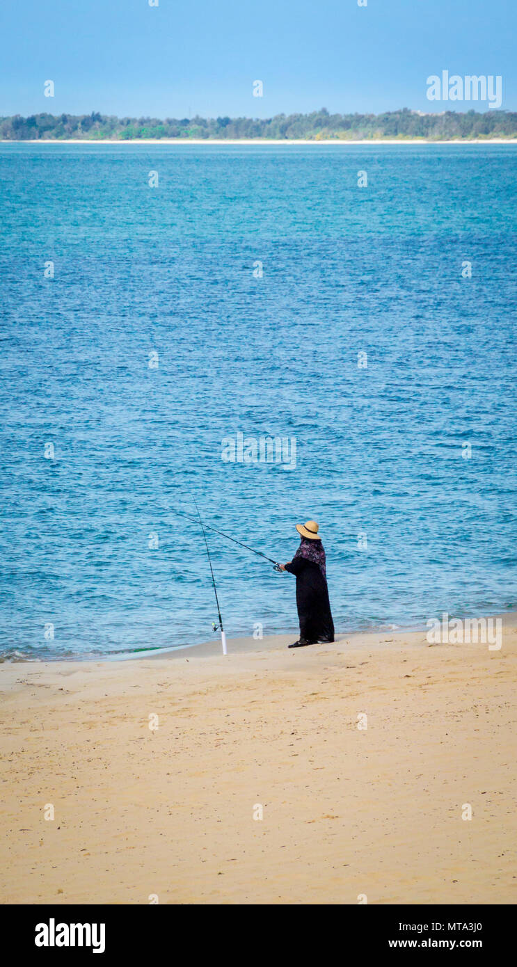 Woman fishing in the pacific ocean hi-res stock photography and images ...