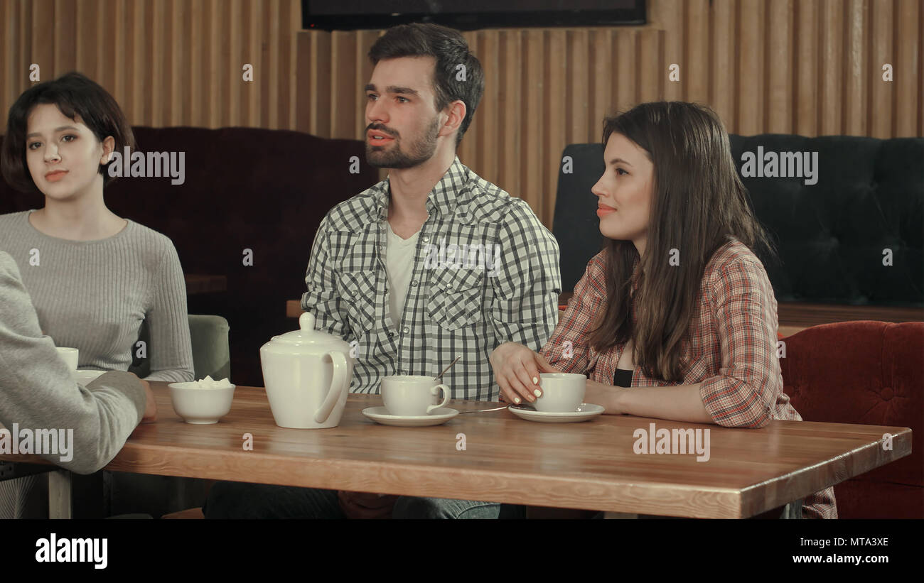 Freelance team members relaxing together in cafe Stock Photo - Alamy