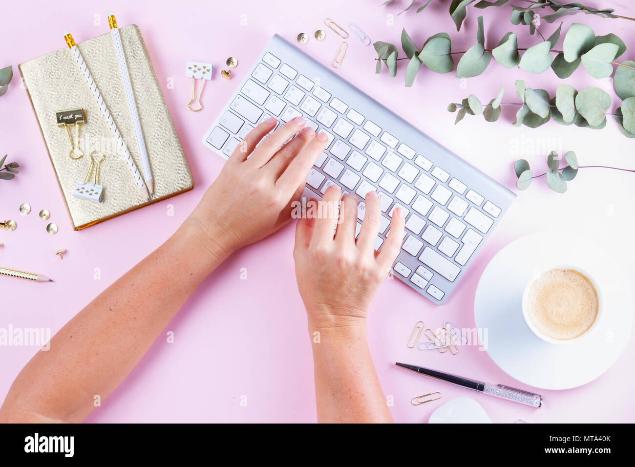 Flat lay home office workspace -someone hands typing on white modern ...