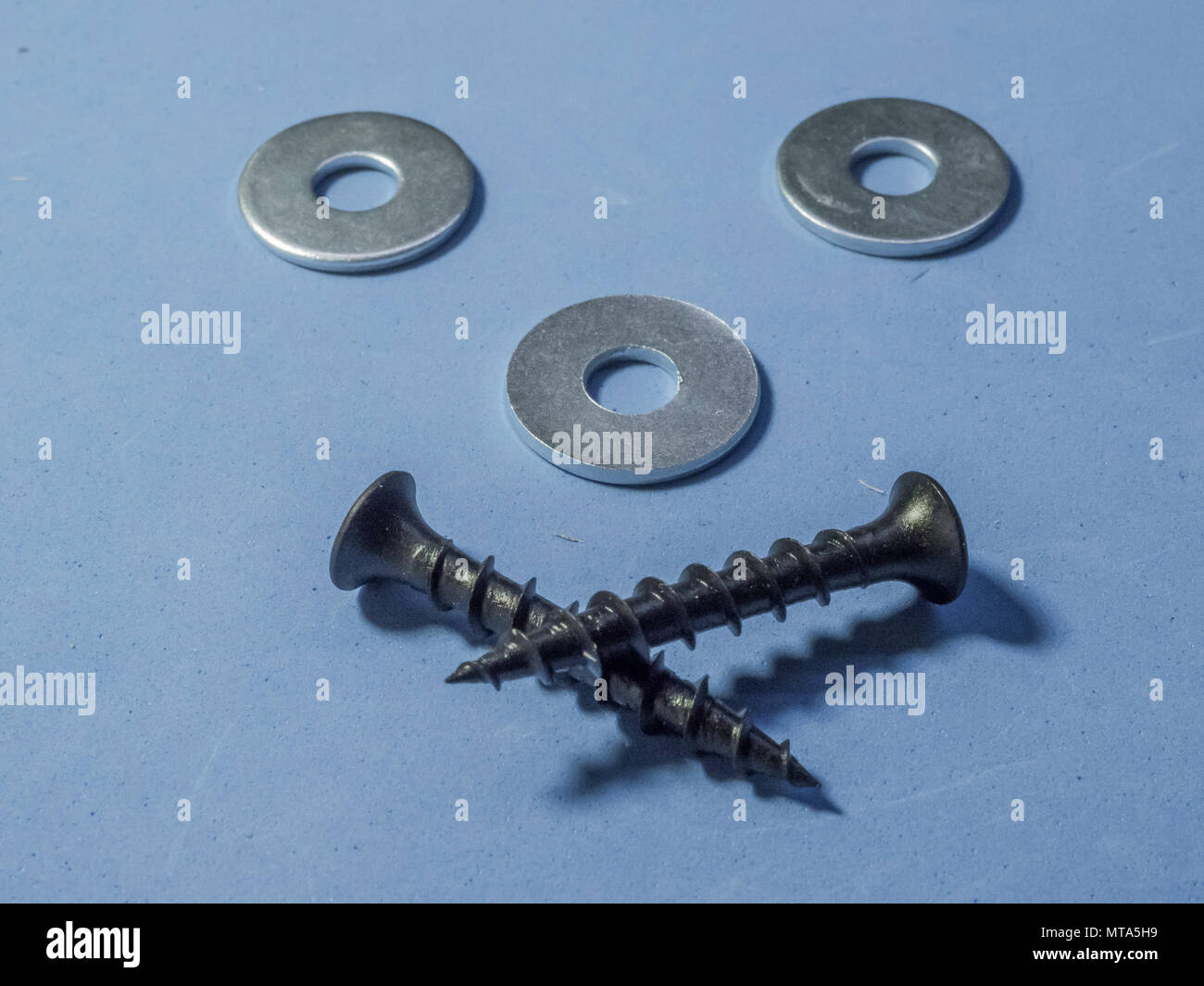 2 screws and 3 washers Stock Photo - Alamy